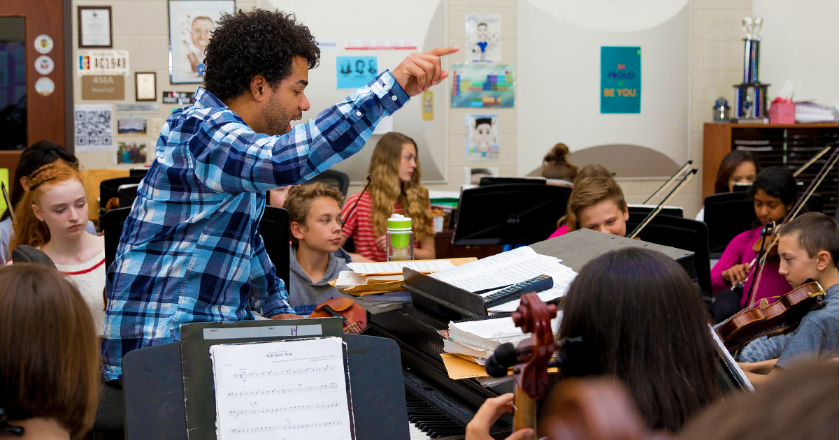 Ben Yoder, an alumnus who is in tune with his music students